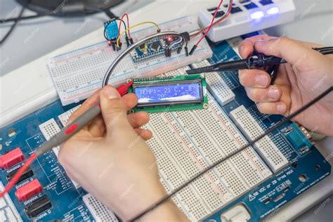 Premium Photo Persons Hands Attach Or Install Electric Silicon Chip Or Sensor B