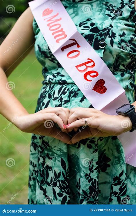 A Pregnant Indian Lady Poses For Outdoor Pregnancy Shoot And Hands On