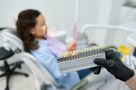 Vita Scale Bleaching Teeth Guide Tooth Color Chart In Dentists Hands