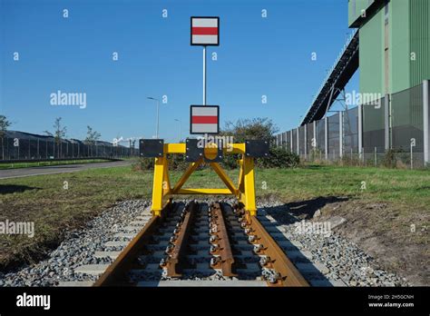 A Yellow Buffer Stop Also Called Bumper Or Stopblock Marking The End Of A Train Track Its