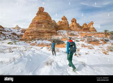 Hikers Heading Towards Snowy Cottonwood Cove In South Coyote Buttes