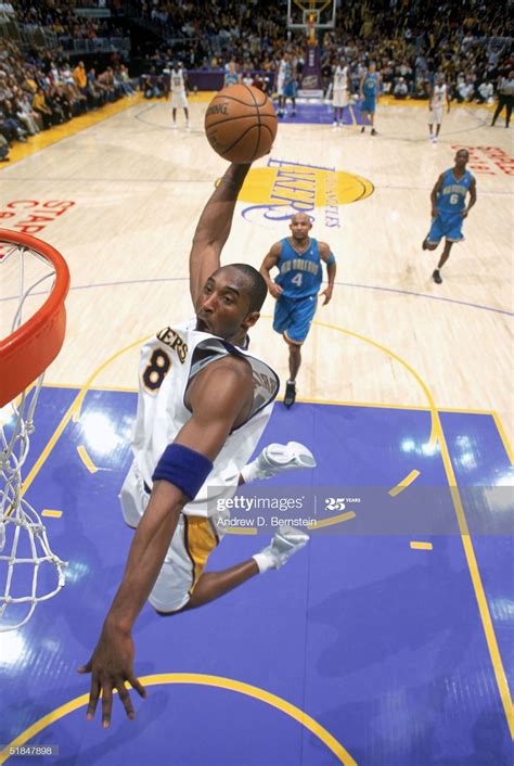 Kobe Bryant Of The Los Angeles Lakers Dunks During The Game Against
