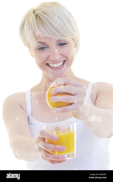 Young woman squeeze orange juice Stock Photo - Alamy