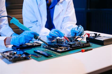 The Technician Is Putting The Cpu On The Socket Of The Computer Motherboard Electronic