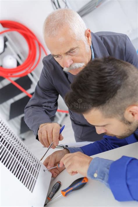 Man Fixing Radiator Stock Photo Image Of Twenties Overalls 254757258