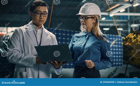 Engineer And Technician Working On Satellite Construction Aerospace