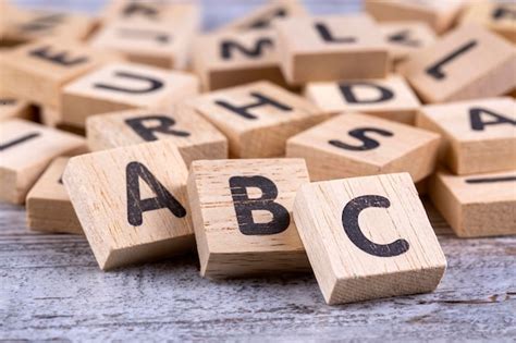 Premium Photo Wooden Alphabet On The Wooden Table
