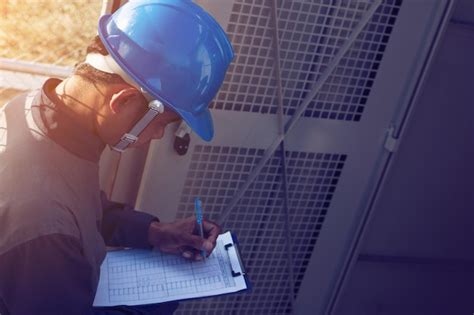 Premium Photo Male Engineer Writing In Paper At Industry
