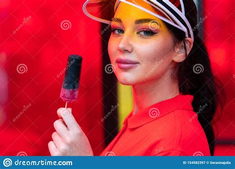 Young Brunette Woman Eating Ice Cream At Sunny Hot Day Seductive