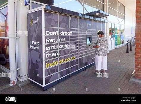 Woman Checks InPost A Polish Logistic Services Business Drop Off