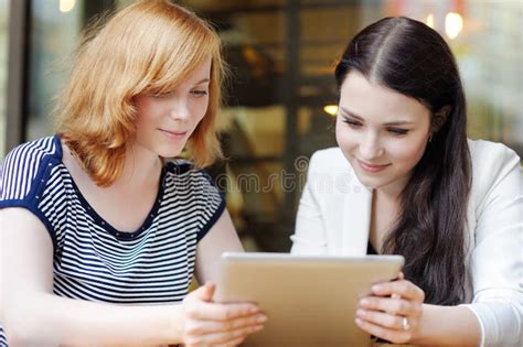 Two Girls Using Tablet Computer Stock Image Image Of Chatting