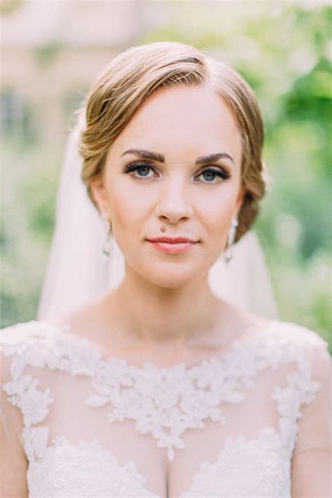Wonderful Bride With The Wedding Bouquet Spending Time In The Forest