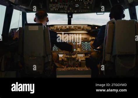 Captain And Copilot Throttling Engine Handle To Fly Airplane Taking