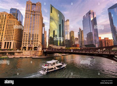 Chicago Downtown Skyline And Speedboat On Chicago River At Sunset