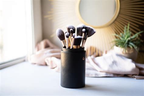 Premium Photo Set Of Luxurious Black Makeup Brushes In Leather Case