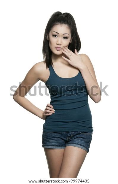 Cute Asian Teenage Girl Making Fun Expression On White Background