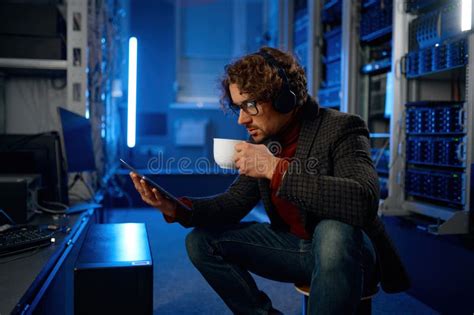 It Technician Using Digital Tablet While Working With Essential Equipment Stock Image Image Of