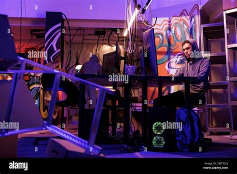 Asian Hacker Coding Computer Virus To Steal Personal Information In Database Young Man In Hood