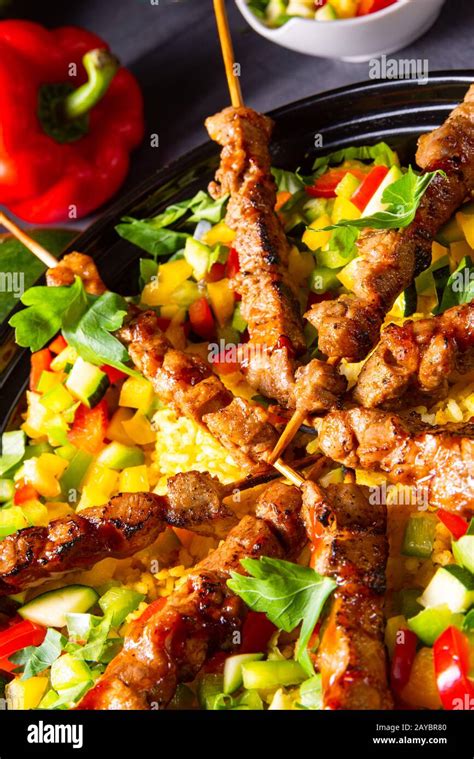 Lamb Skewers With Curry Rice And Different Vegetables Stock Photo Alamy