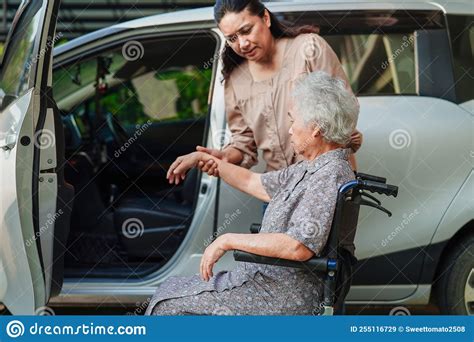 Caregiver Help And Care Asian Senior Or Elderly Old Lady Woman Patient