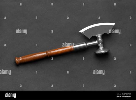 Kitchen Ax With A Brown Wooden Handle On A Black Background Cleaver For Cutting Meat Top View