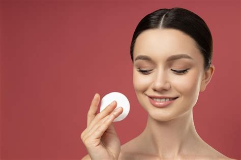 Premium Photo An Attractive Girl With A Cotton Pad In Her Hand