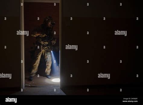 A U S Army Operational Detachment Alpha ODA Member Searches A Room