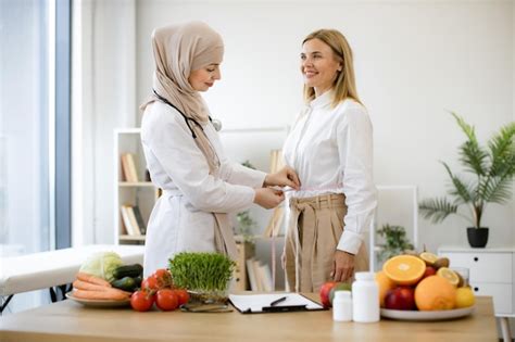 Premium Photo Muslim Woman In Doctors Coat And Hijab Finding Out