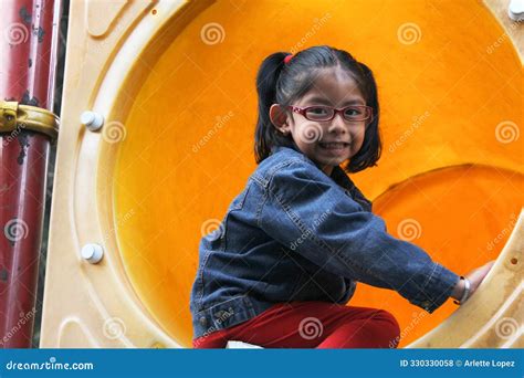 4 Year Old Latina Girl With Glasses Plays In Park Games Enjoys Weekend