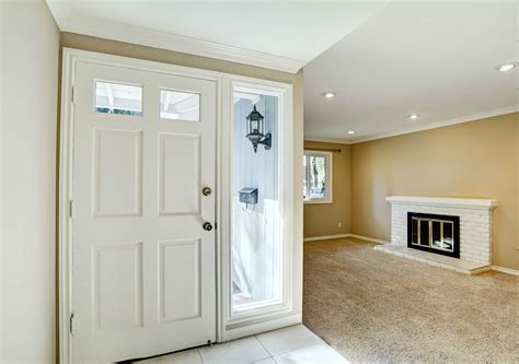Front Door Entry With Tile Floor And Step Down Formal Living Room With