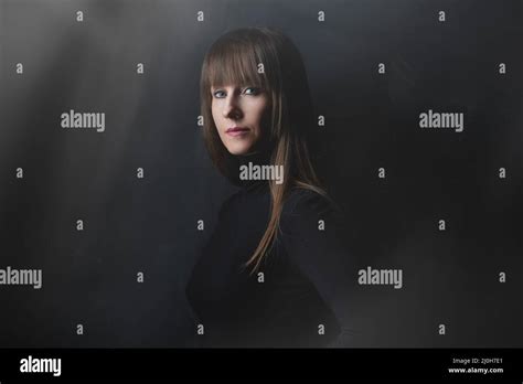 Beauty Portrait Of Attractive Young Woman Looking At Camera Serious
