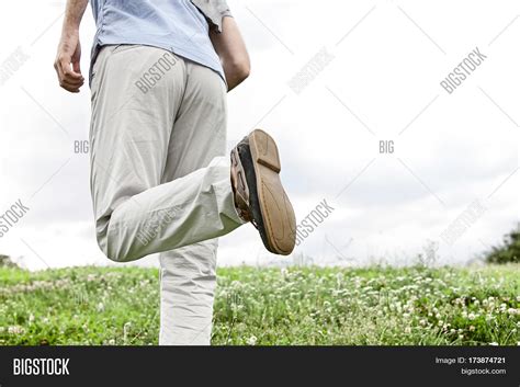 Cropped Image Of Man Running In Park Against Sky Stock Photo Stock Images Bigstock
