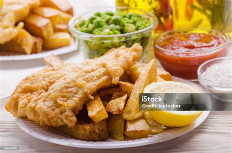 Traditional British Street Food Fish And Chips With Ketchup Sauce And
