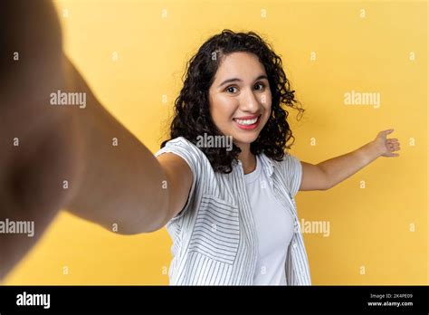 Portrait Of Friendly Positive Optimistic Woman With Dark Wavy Hair