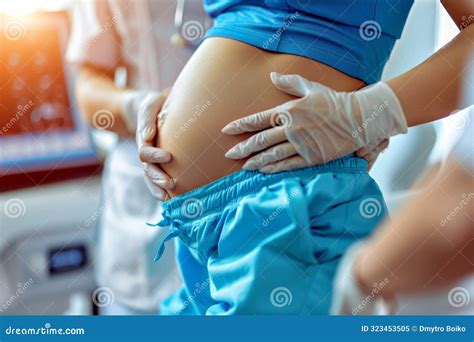 Doctor Conducting Ultrasound Examination On Pregnant Woman For Prenatal