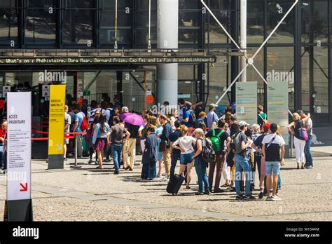 Tourists Queuing For Entry To The Centre Pompidou Art Gallery Paris