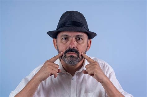 Premium Photo Portrait Of 60 Years Old Bearded Man On Blue Background