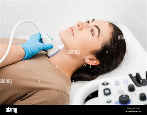 Female Patient Receives Thyroid Diagnostics Treatment Of