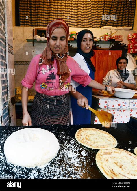 Moroccan Women Preparing Traditional Moroccan Bread In A Small Shop At