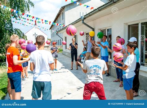 Teenagers Simultaneously Throwing The Ball In A Circle In A Sports Game Team Building