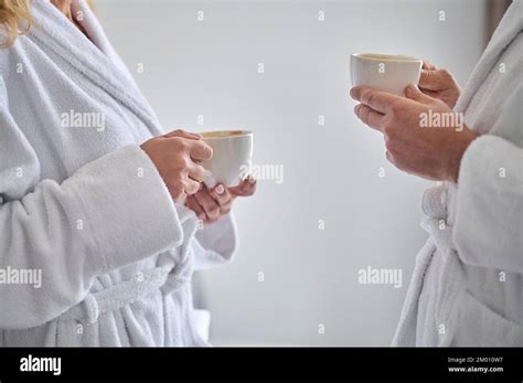 Two People Standing Next To Each Other