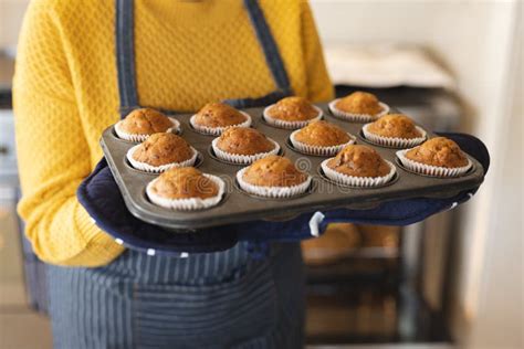Image Of Midsection Of African American Woman With Tray Of Freshly Made