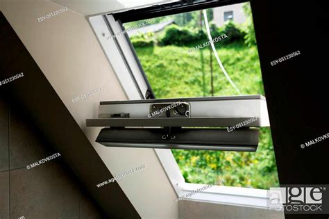 Plastic Mansard Or Skylight Window On Attic With Environmentally