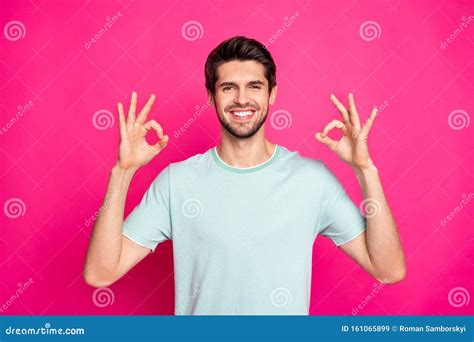 Photo Of Funny Macho Guy Showing Okey Symbol Expressing Agreement And
