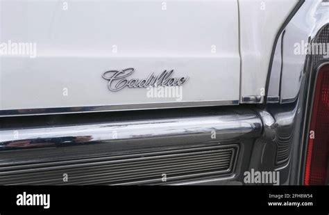 Cadillac Script Logo On Old White Cadillac De Ville Car Stock Video Cadillac Script Logo On Old White Cadillac De Ville Car Stock Video