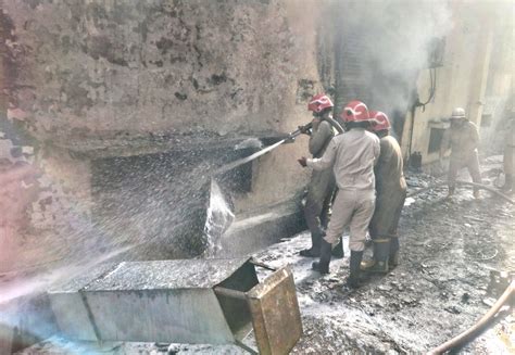 New Delhi Smoke Billows As Firefighters Try To Douse A Fire At A Showroom