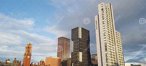 Kimpton Clock Tower In Manchester With Adjacent Skycrapper Buildings