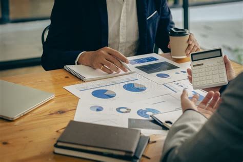 Business Team Analyzing Data Using Computer While Spending Time In Office Financial Planning