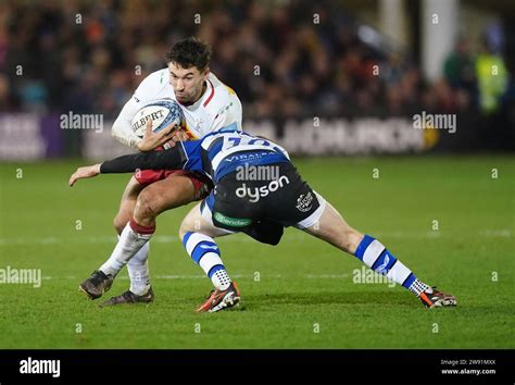 Harlequins Nick David Is Tackled By Baths Finn Russell During The