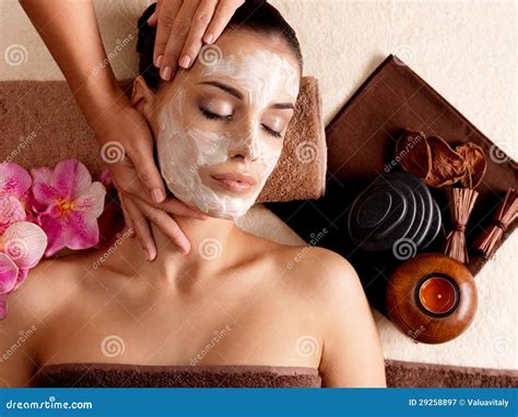 Spa Massage For Woman With Facial Mask On Face Stock Image Image Of